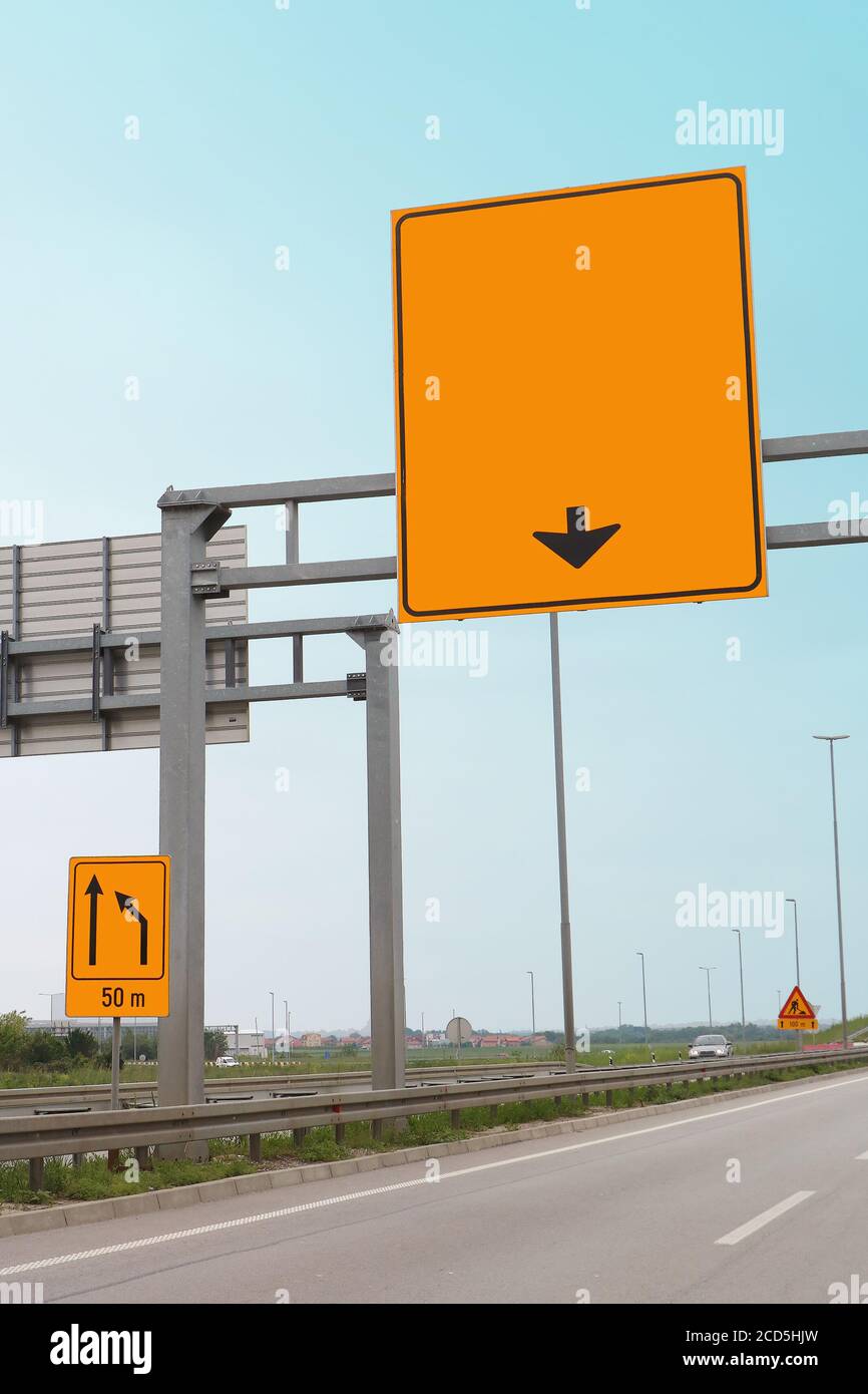 Empty highway road with traffic signs on all sides Stock Photo - Alamy