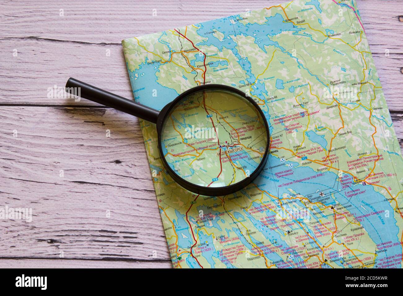 Magnifying glass and ancient map on the wooden background Stock Photo ...