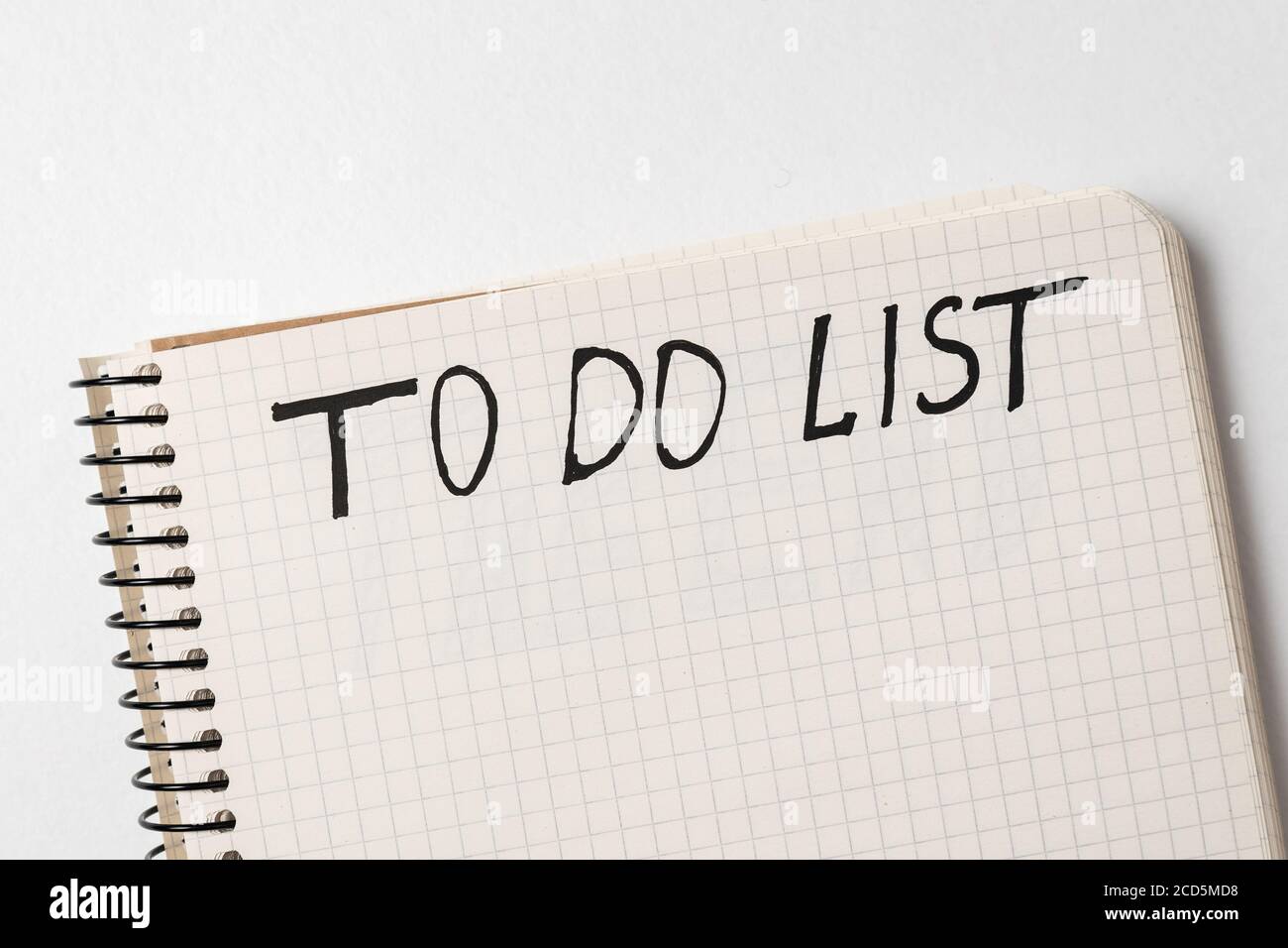Handwriting notice To do list. Notebook on white background. Top view ...