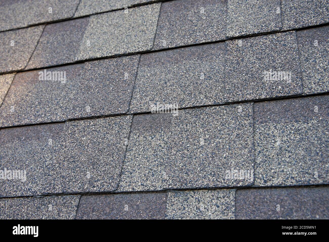 Close up view on asphalt roofing shingles background Stock Photo - Alamy
