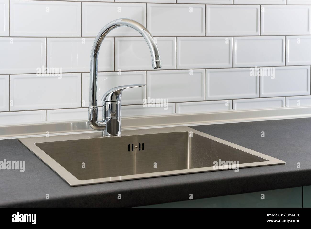 Kitchen sink and water tap in the kitchen in a modern apartment ...
