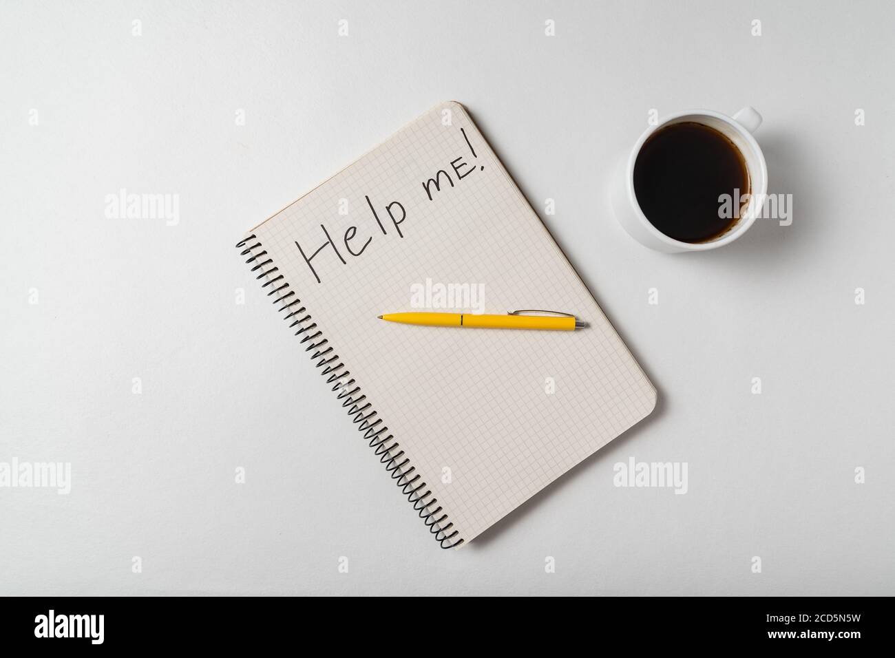 Notepad with the words HELP ME on white background. Cry for assistance ...