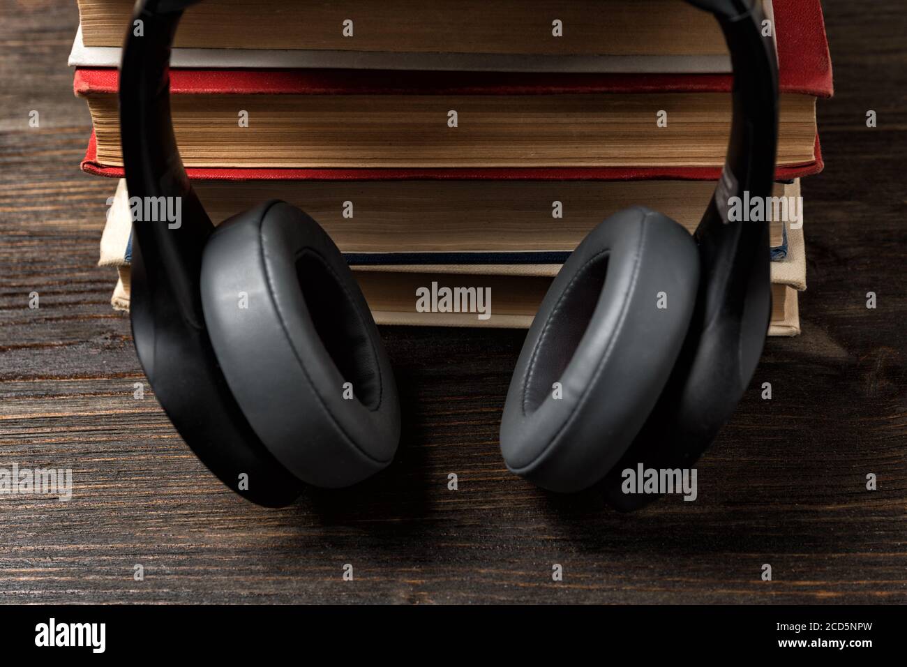 Books and headphones. Learning using audiobooks concept. Quick ...