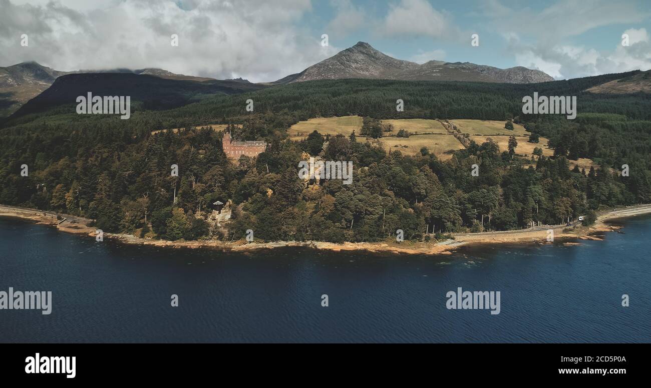 Scotland, Brodick ocean bay aerial view: alone sailboat at Firth-of ...