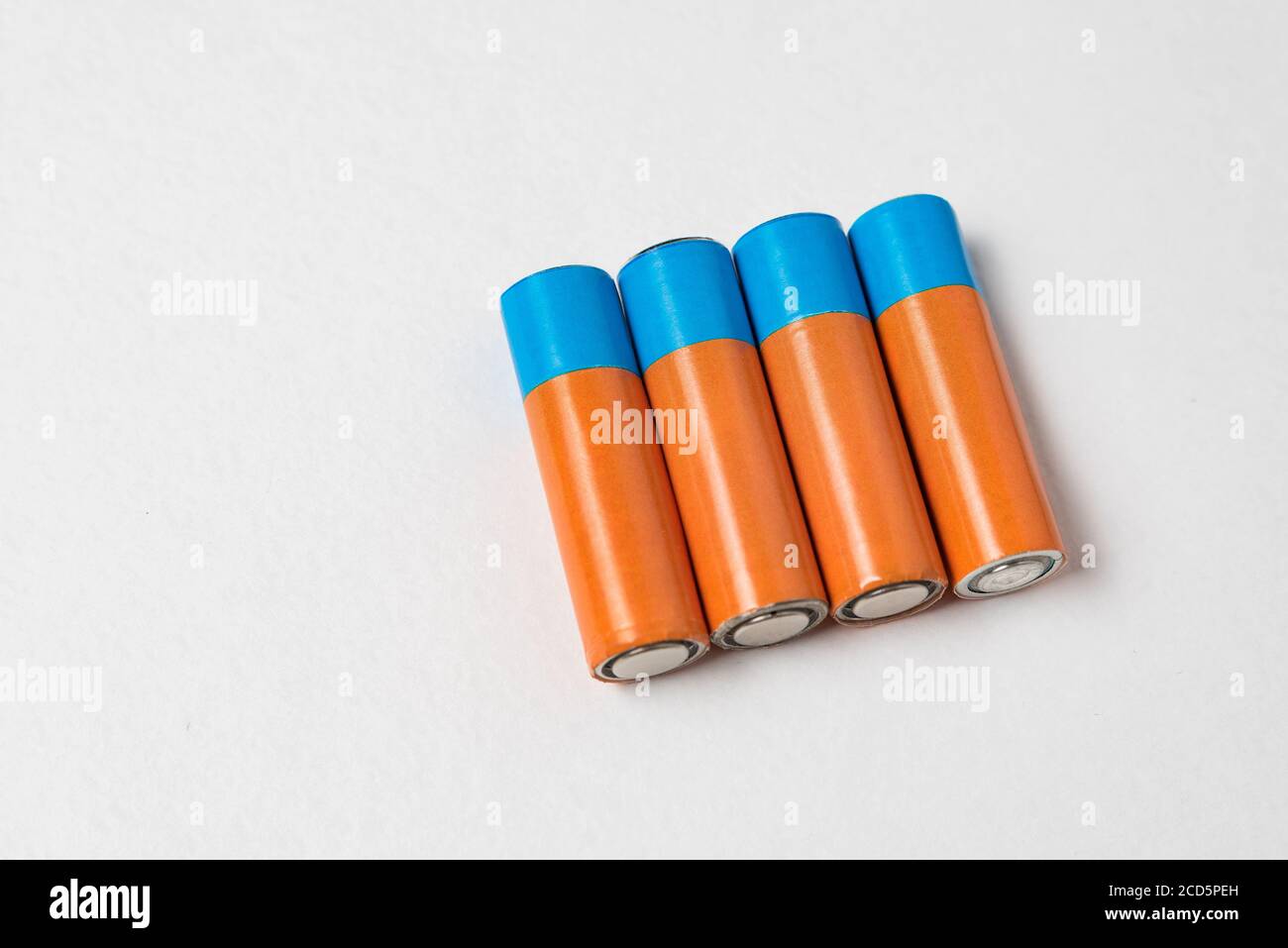 Four generic AA batteries on a white background. Copy space Stock Photo ...