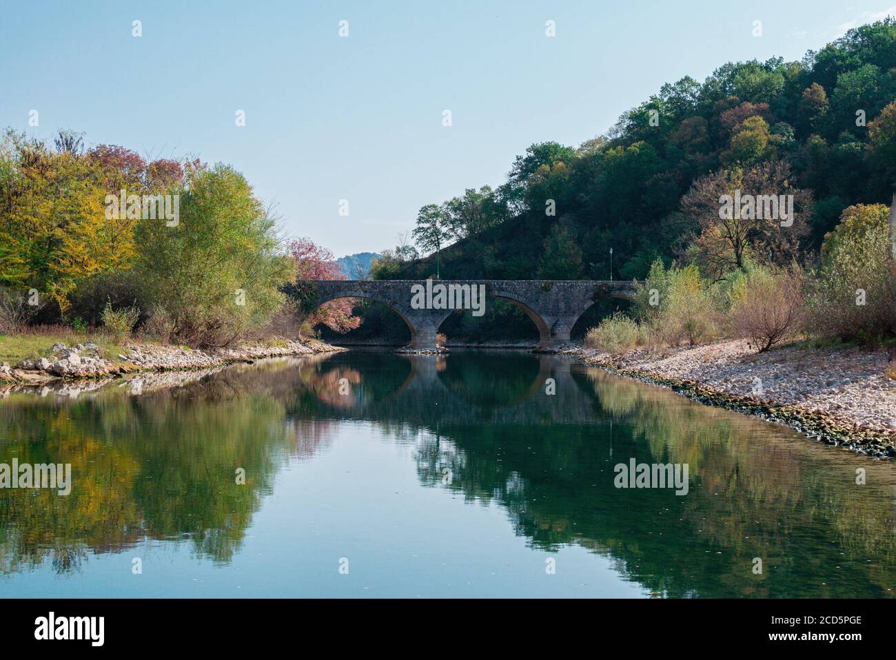 old stone arch bridge over river in Montenegro, landscape Stock Photo ...
