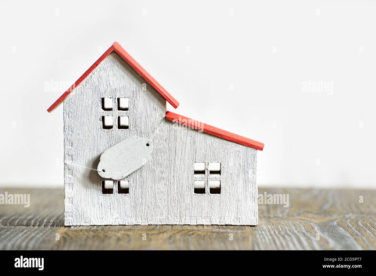 Model of a wooden house with a sign. Home sale purchase concept Stock ...