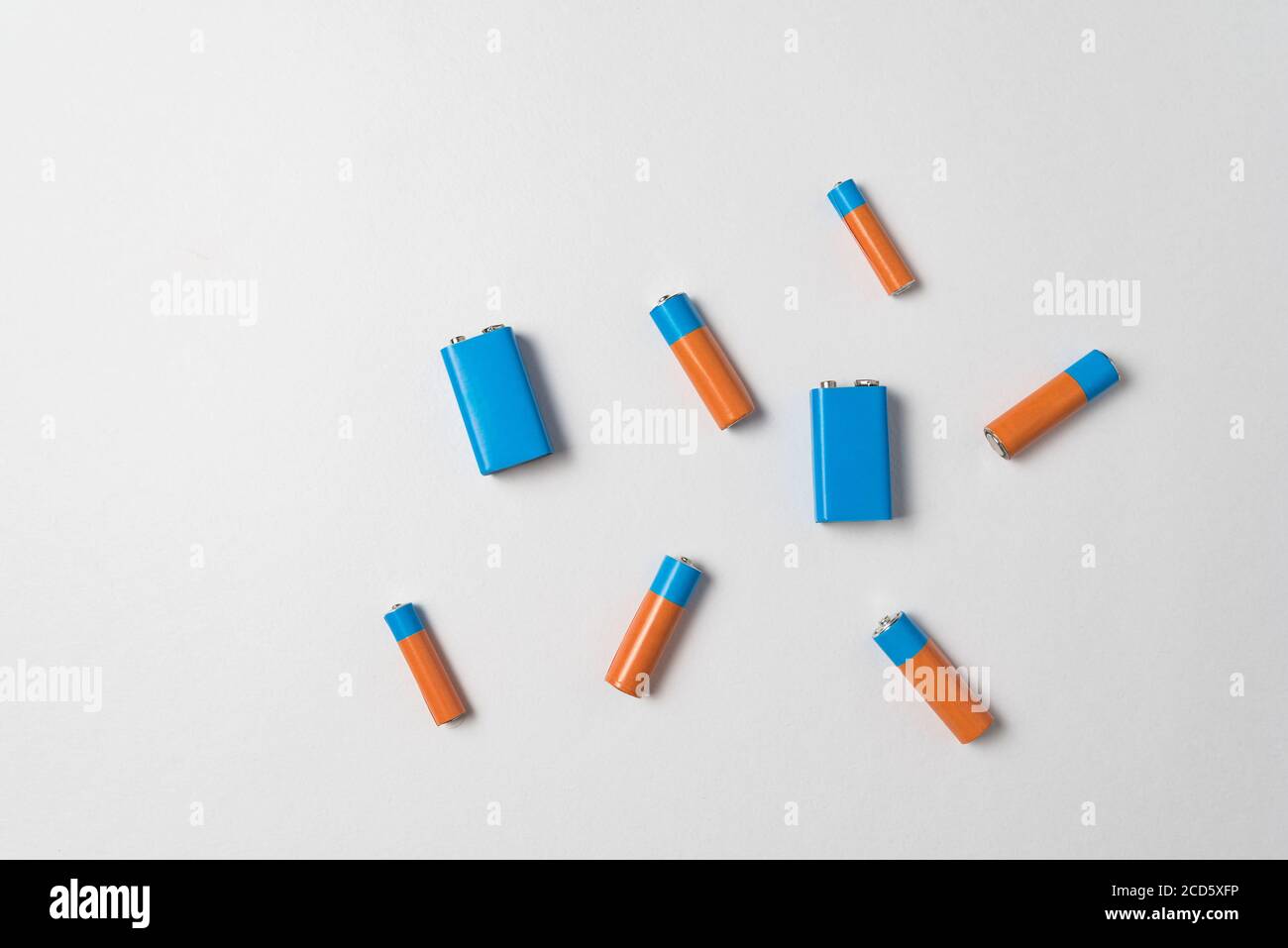 Generic AA and PP3 batteries on a white background. Different types of ...