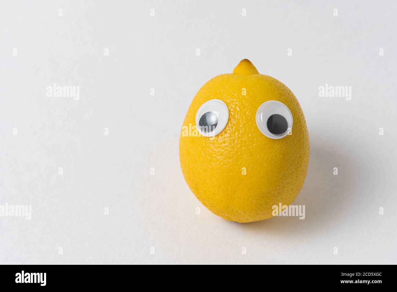 Fresh Lemon with eyes on white background. Food with Funny Face Stock ...
