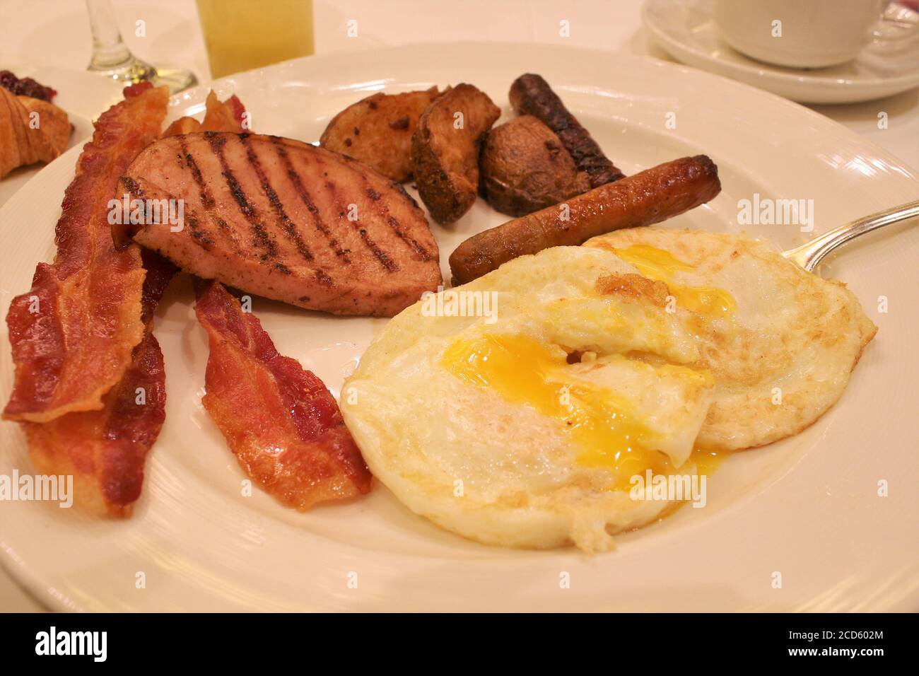 Breakfast meal of eggs, bacon, sausage and ham Stock Photo - Alamy