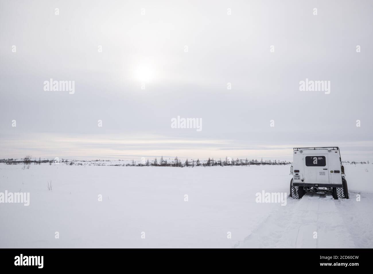 A trekol (russian all terrain six wheels vehicle) in the snow, tundra ...