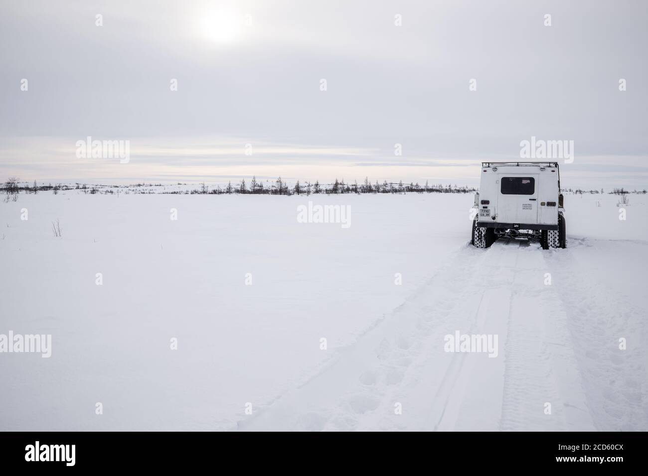 A trekol (russian all terrain six wheels vehicle) in the snow, tundra ...