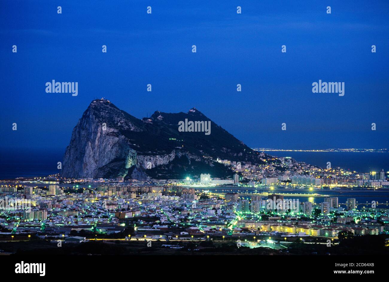 Rock of Gibraltar and city of Gibraltar at night Stock Photo - Alamy