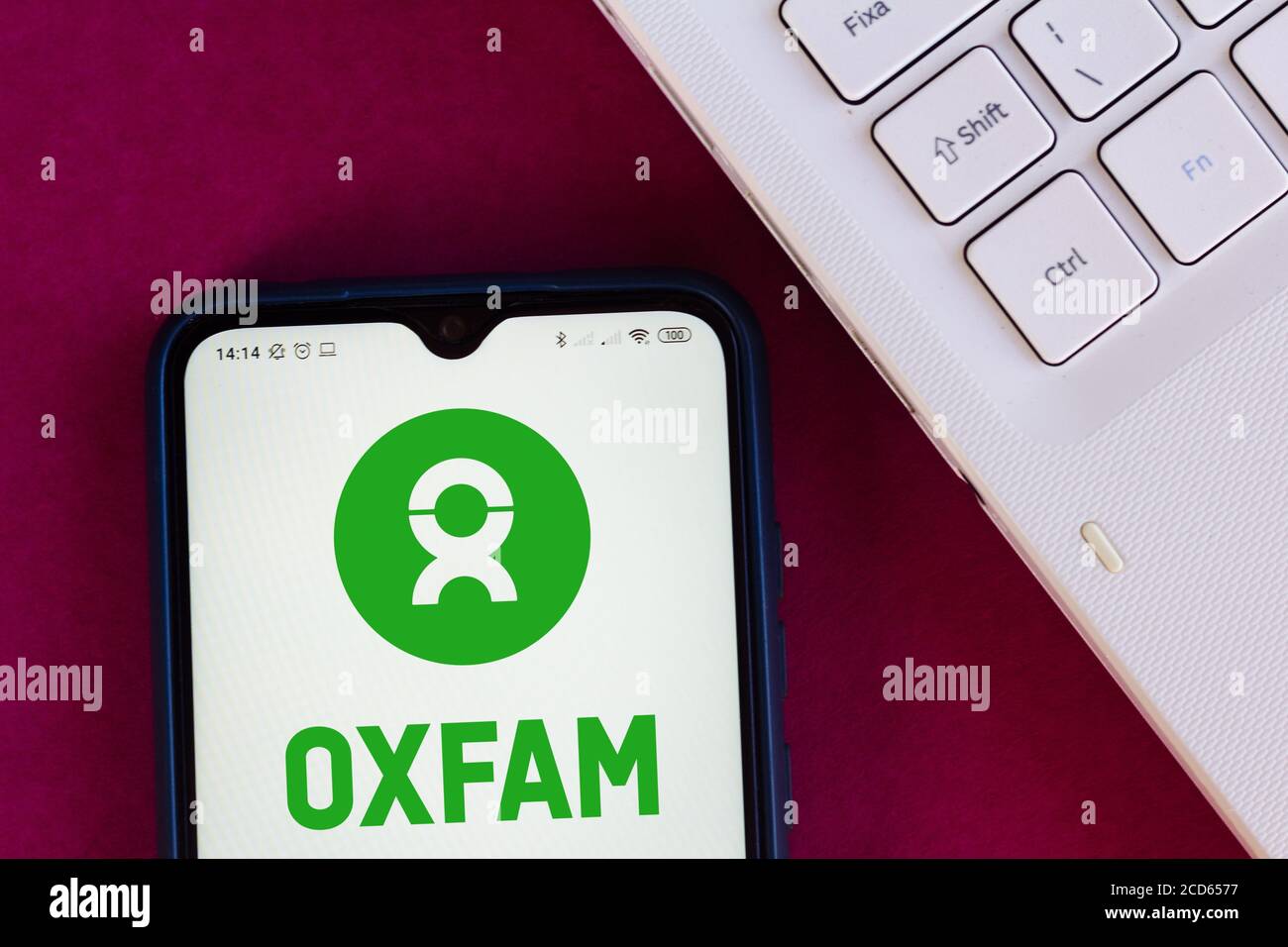 In this photo illustration the Oxfam International logo seen displayed ...