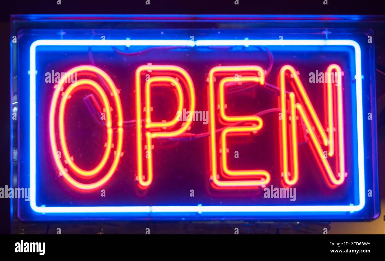 Open sign, illuminated in bluie and red neon lighting Stock Photo - Alamy