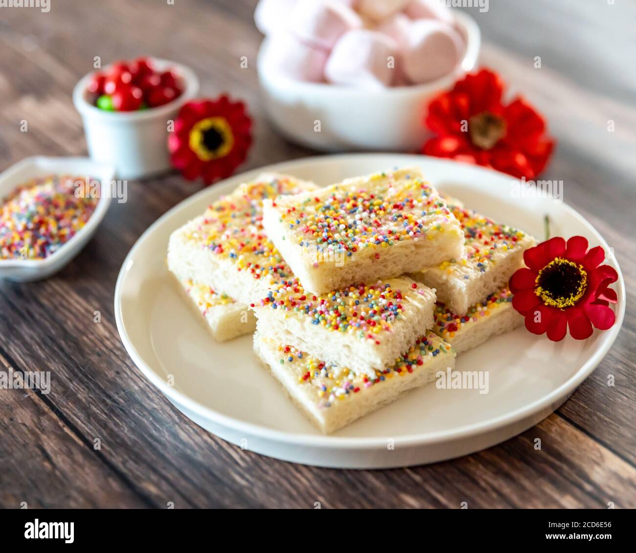 Fairy Bread Slice with sweets background blur Stock Photo - Alamy