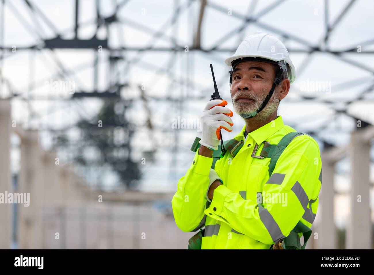 Asian senior engineer technician watching construction control in the ...