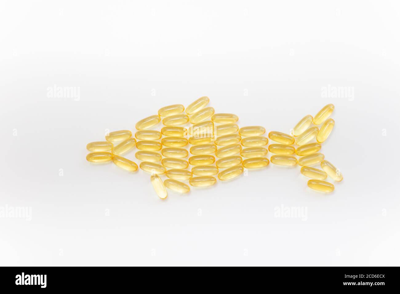 Fish shape Cod Liver Oil Capsules, Omega 3, Vitamin D on white ...