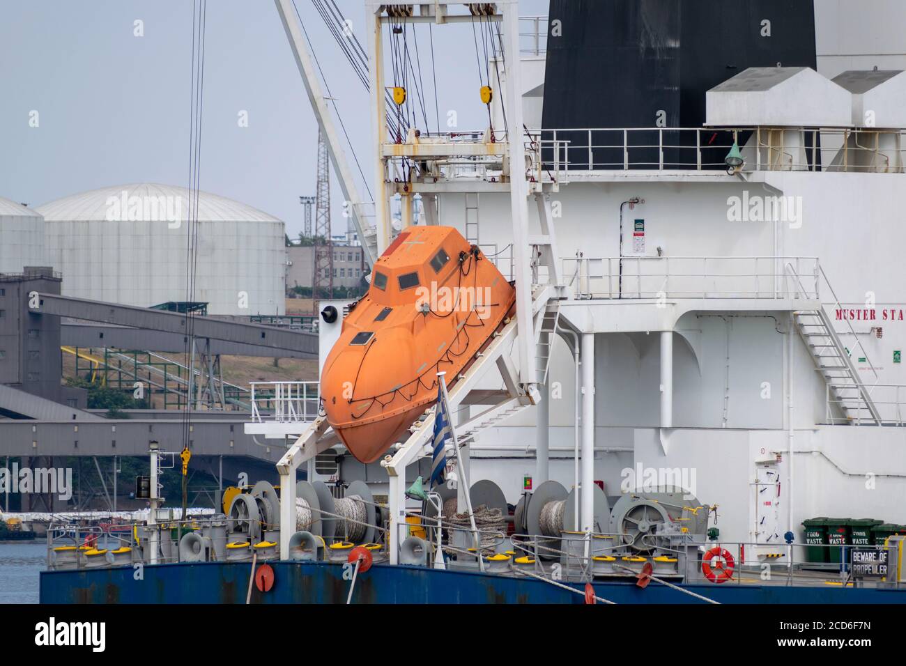 Lifeboat survival capsule on the cargo ship Stock Photo - Alamy