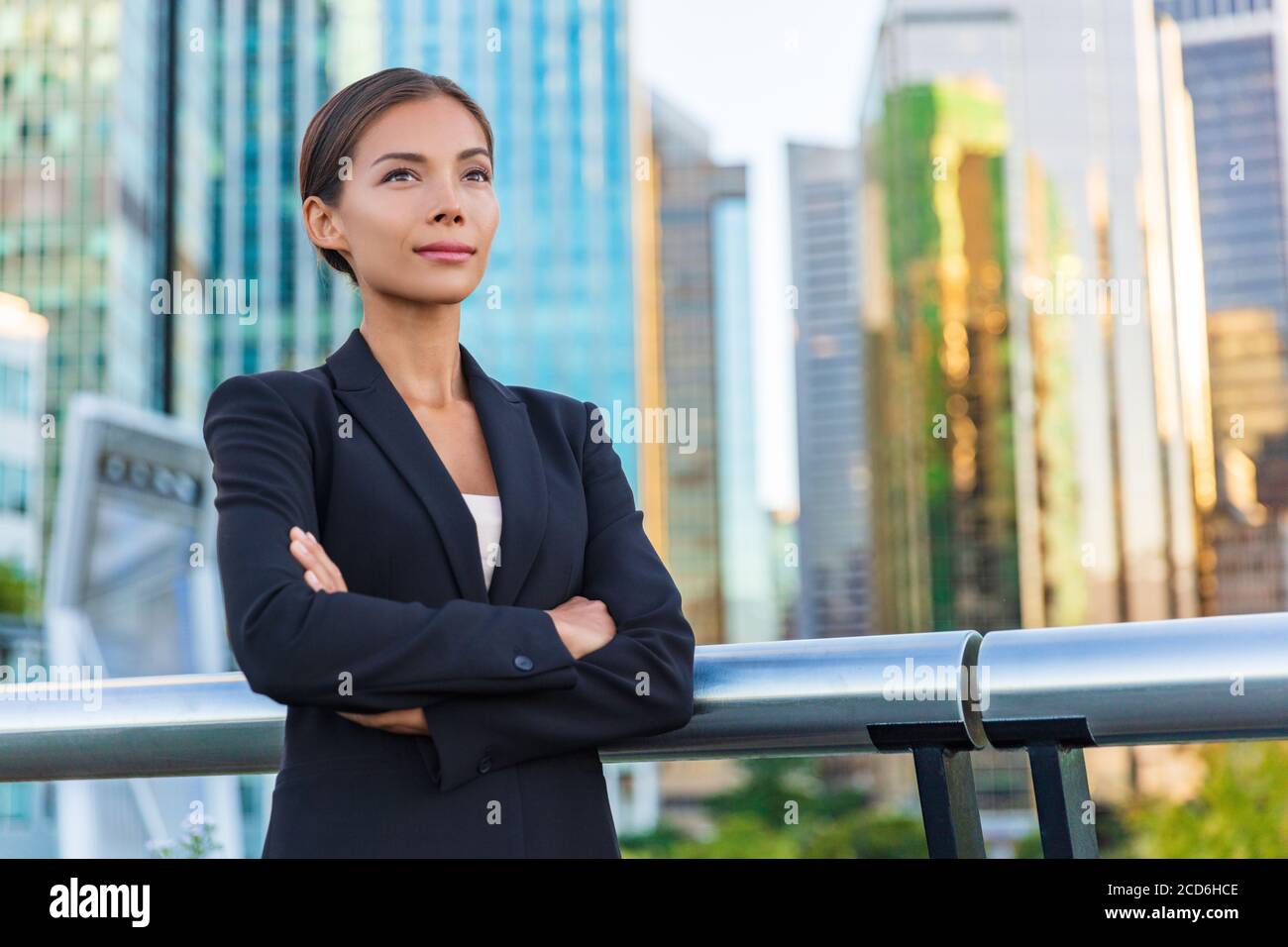 Asian businesswoman confident looking away contemplating career city ...