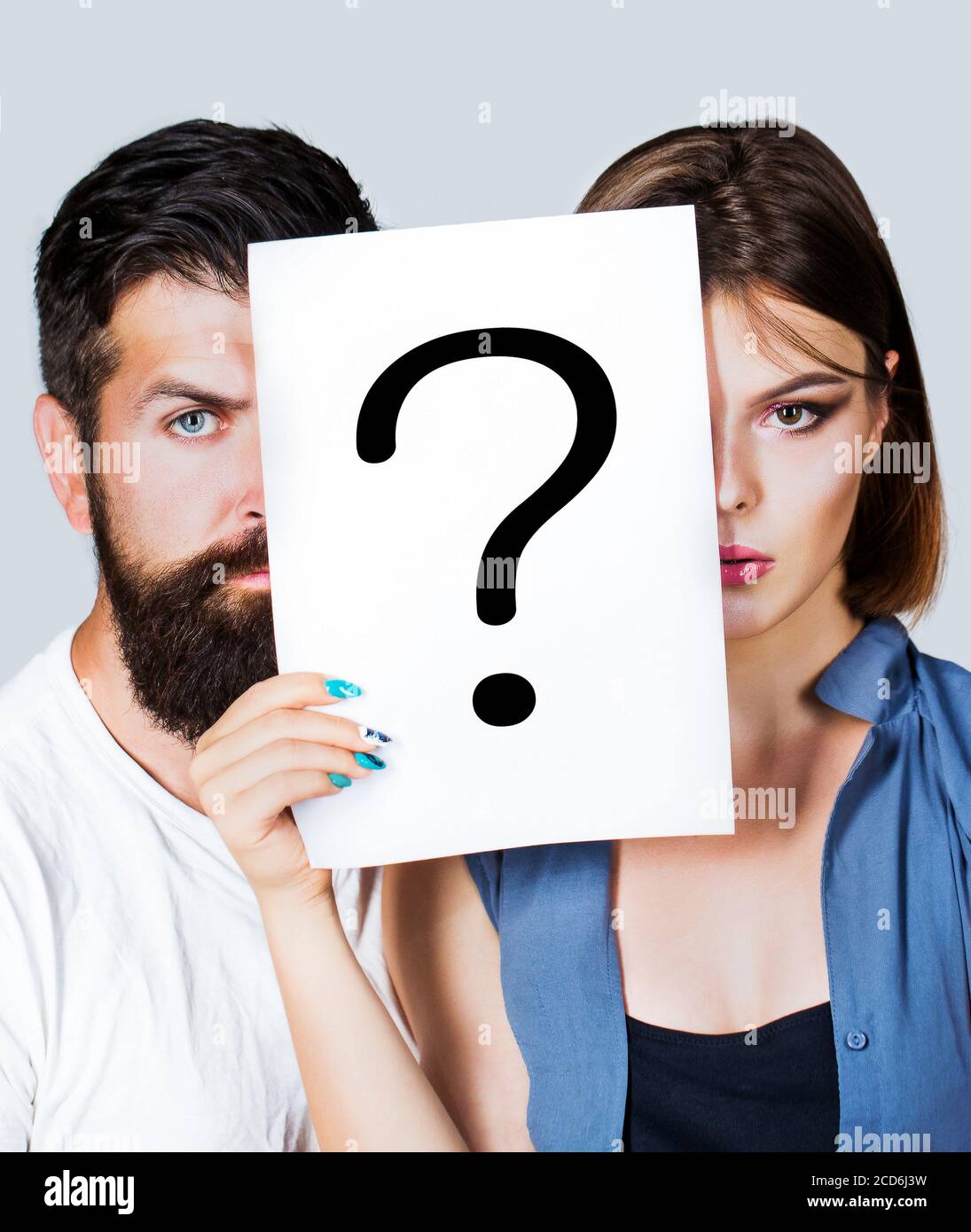 Couple holding paper question mark. Anonymous, man and woman question ...
