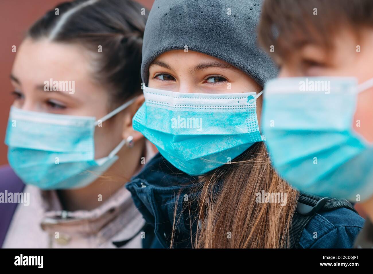 School-age children in medical masks. portrait of school children Stock ...