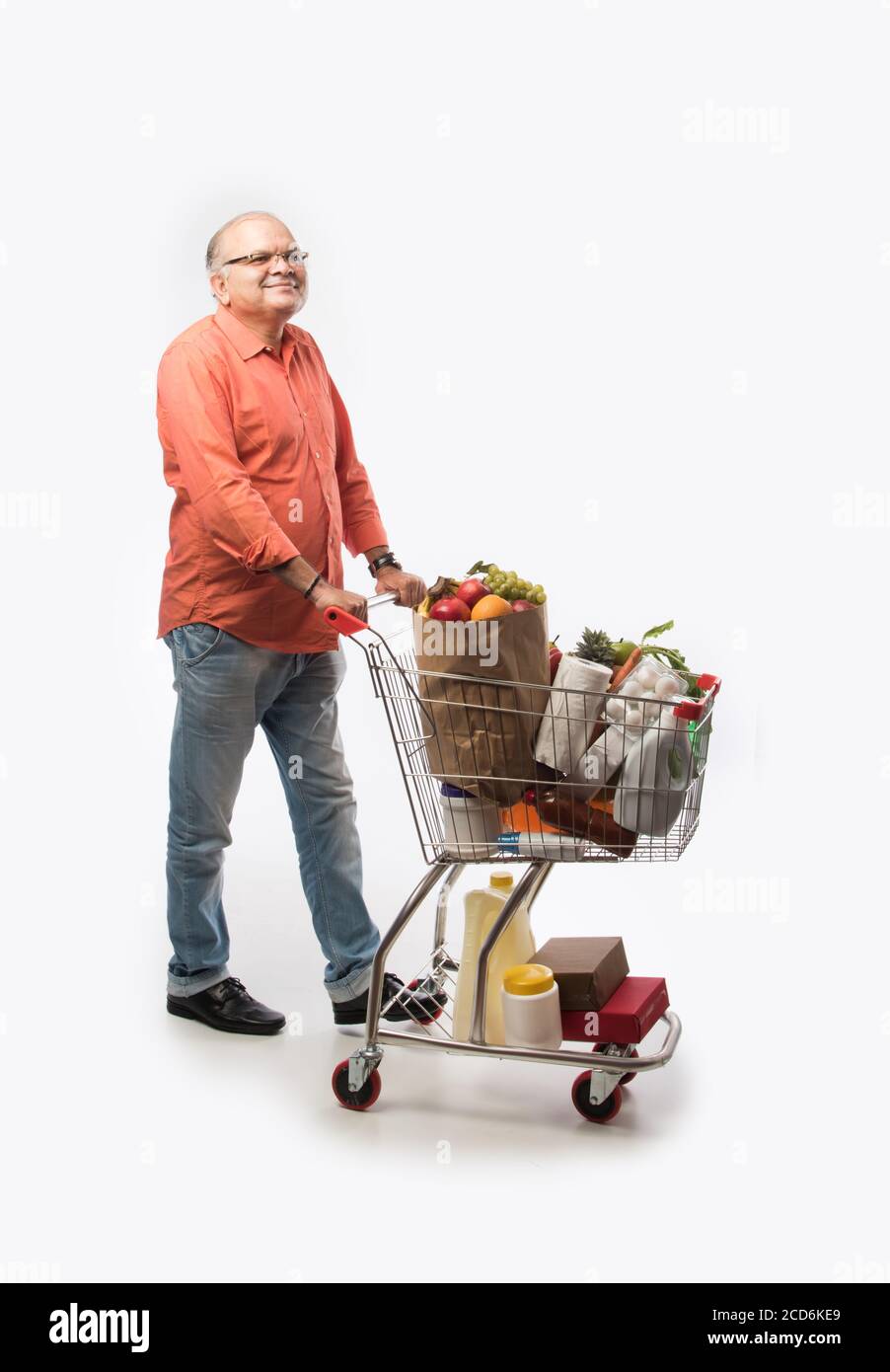 Indian old man with shopping cart or trolly full of vegetables, fruits ...