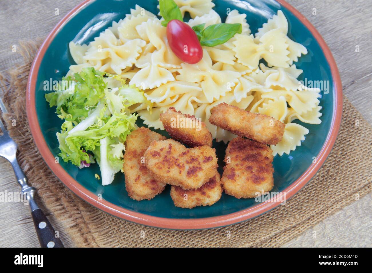 plate of chicken nuggets and pasta Stock Photo - Alamy