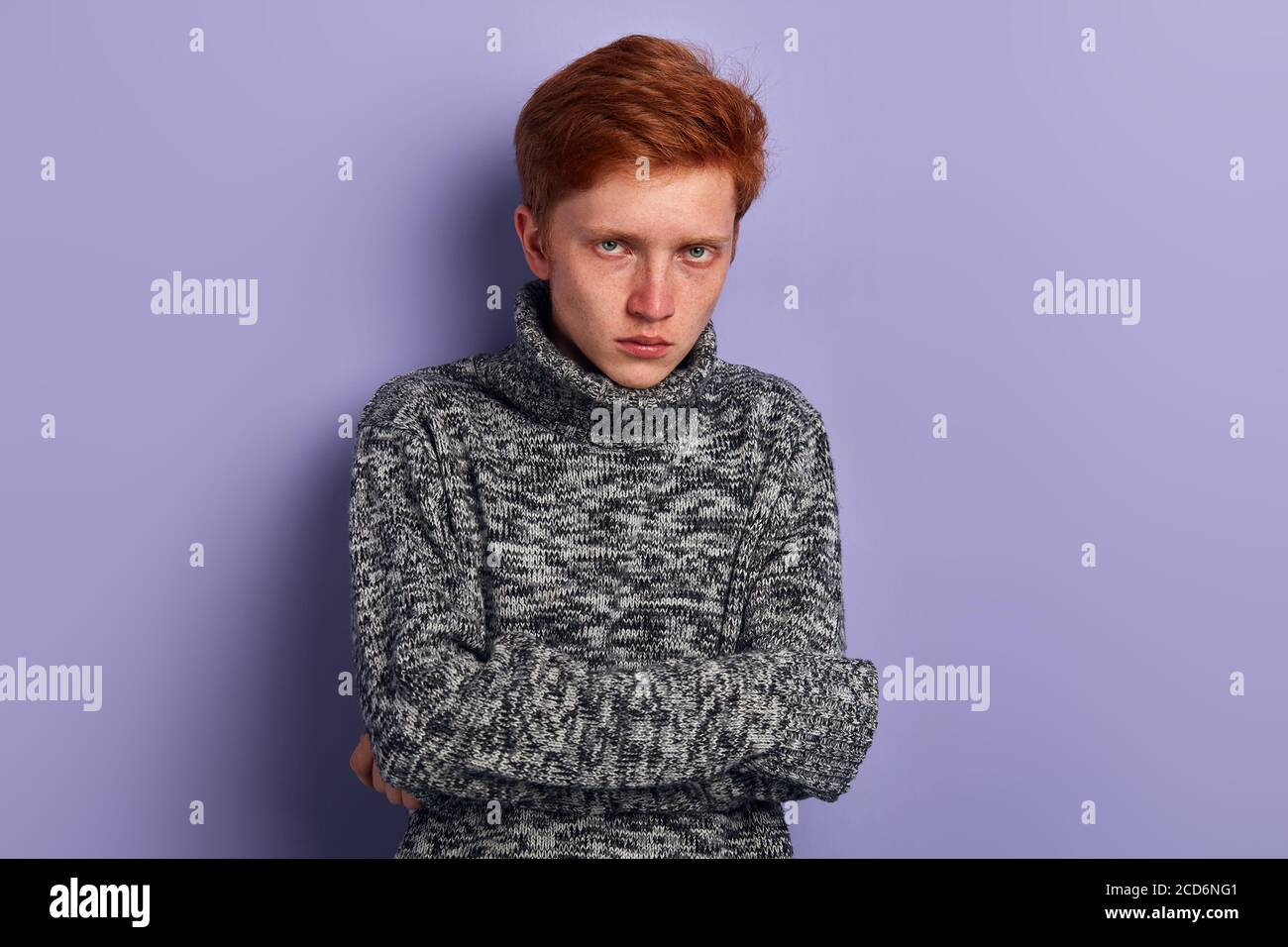 poor unhappy serious man hugging himself , feeling cold. close up ...