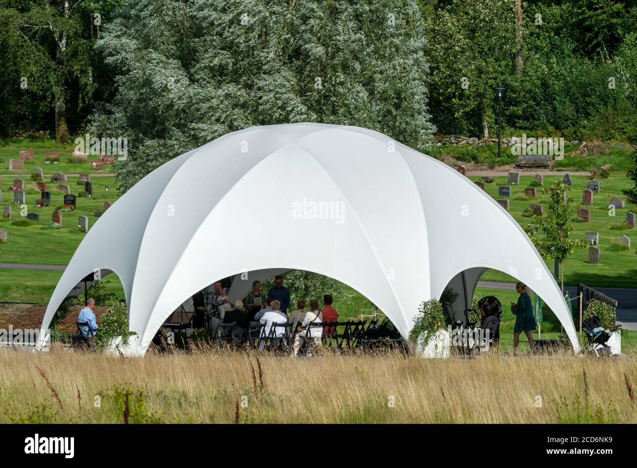 PARTILLE, SWEDEN - Aug 22, 2020: A white chapel, a cemetery, has been ...