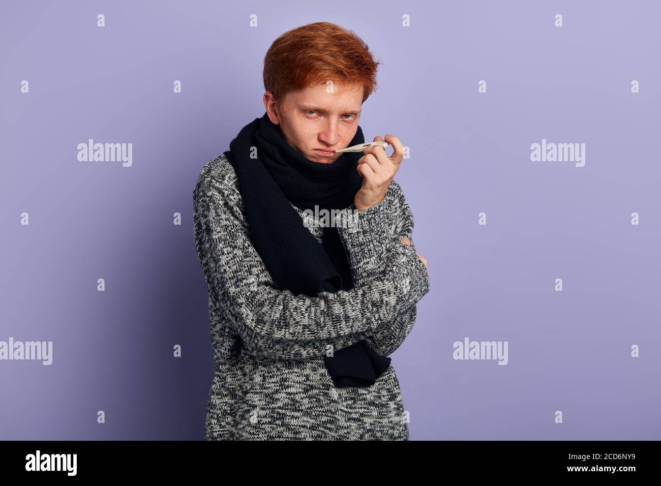 sick pale unhappy sad depressed man with thermometer in mouth. close up ...