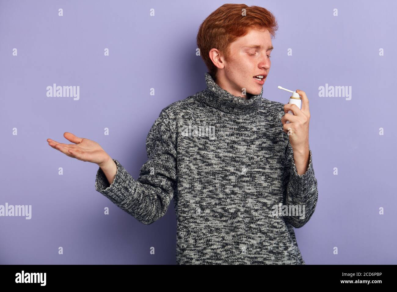 young man has cought cold. close up side view photo, isolated blue ...