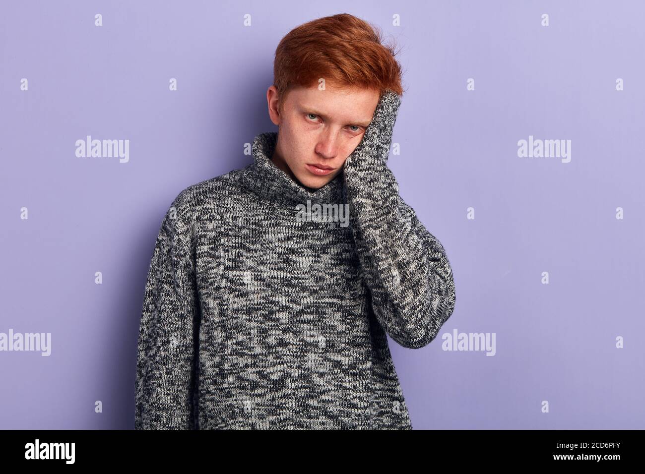 unhappy depressed drunk man with a hand on his cheek looking at the ...