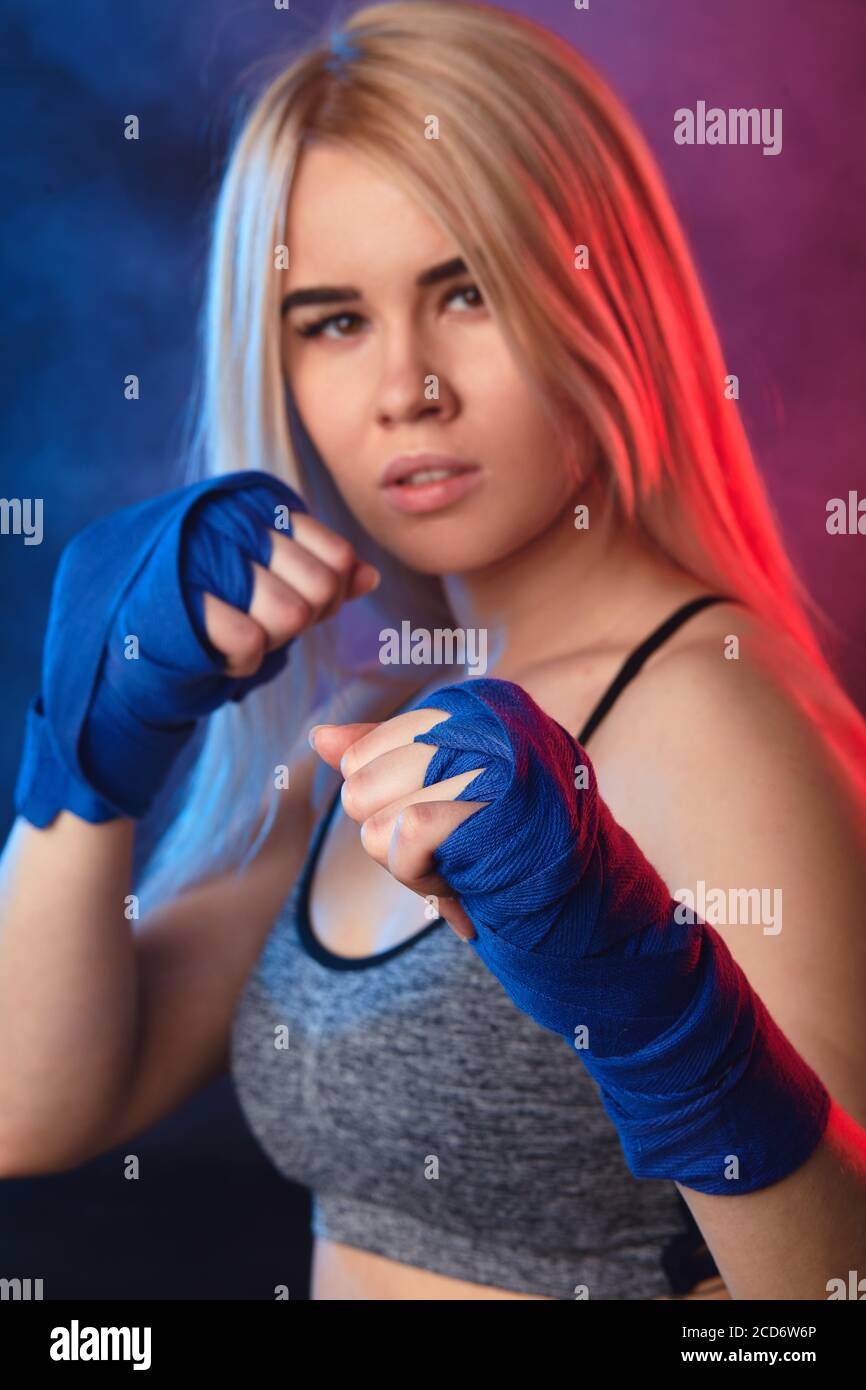Close up face portrait of attractive blonde woman fighter in boxing ...