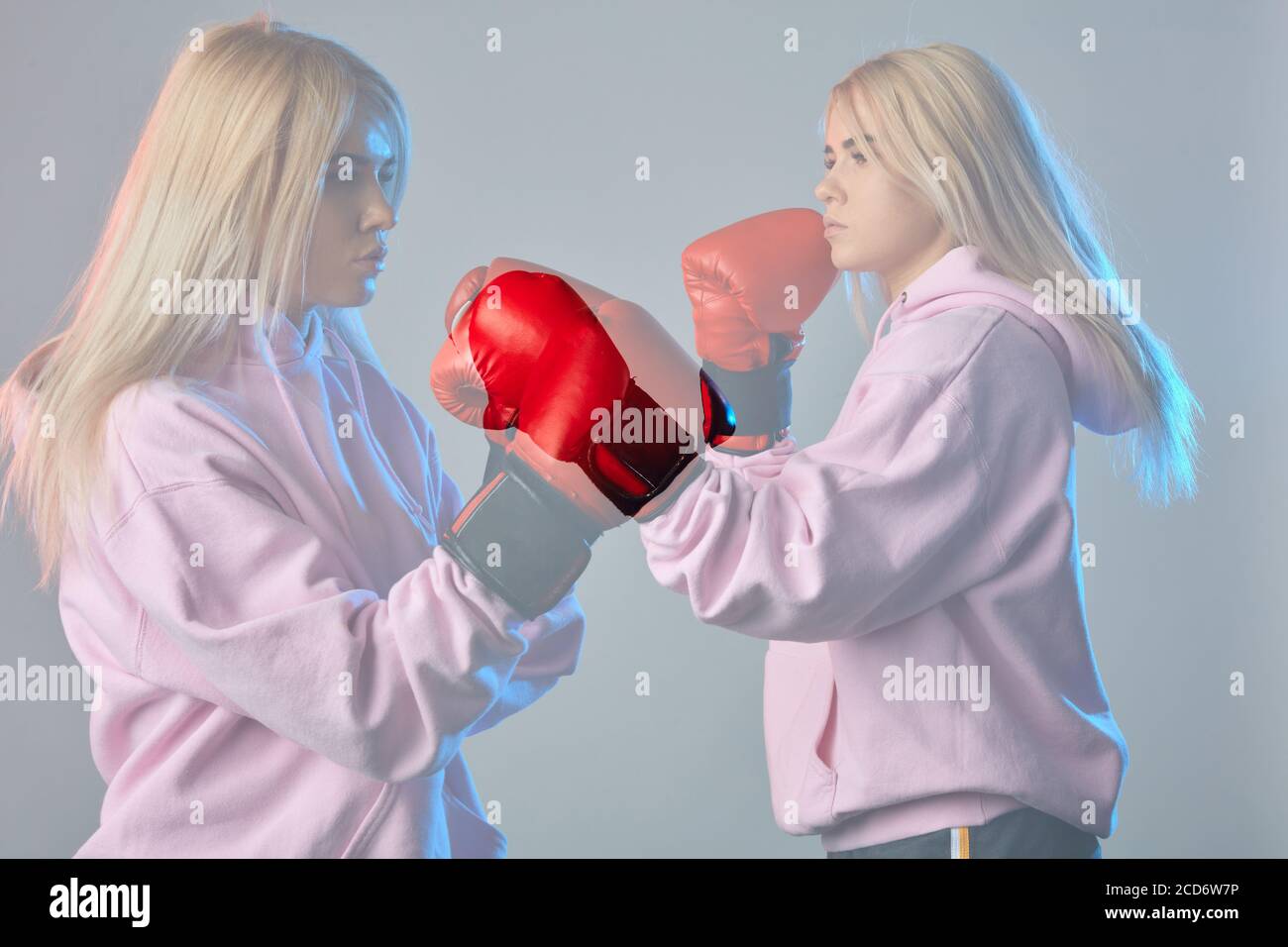 Two female boxers during a sparring in the boxing ring. Digital image ...