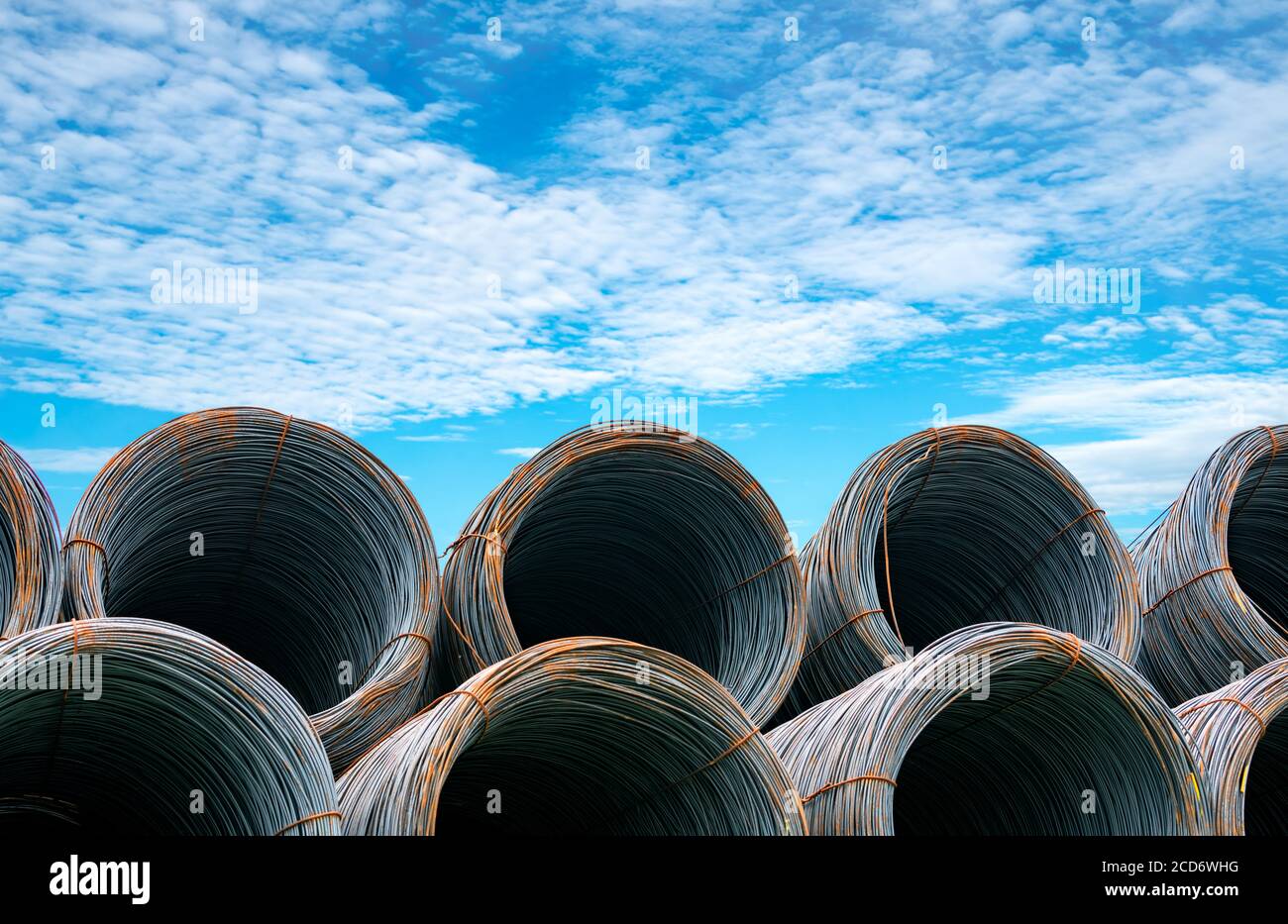 Steel wire coil against blue sky. Metal steel reinforced for concrete ...