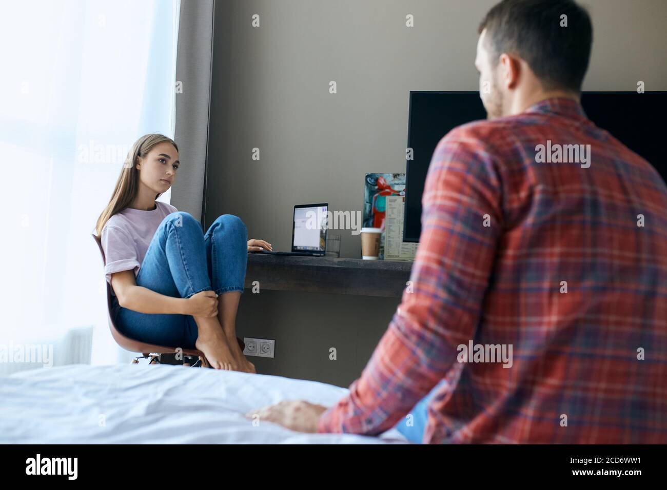 Young pretty lovers talking in bedroom, discussing future plans ...