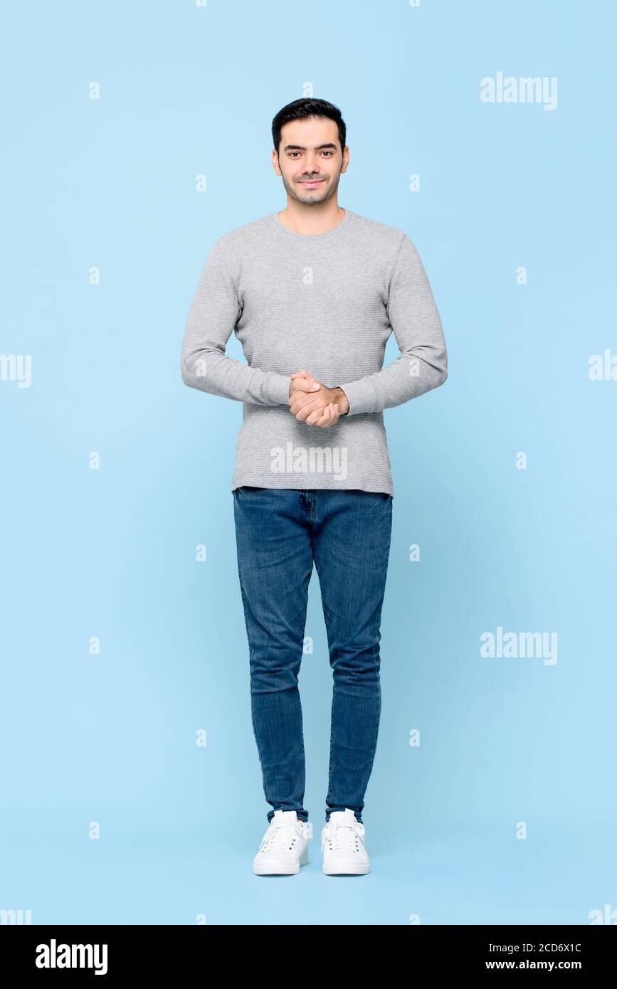 Full length portrait of young polite handsome Caucasian man standing ...