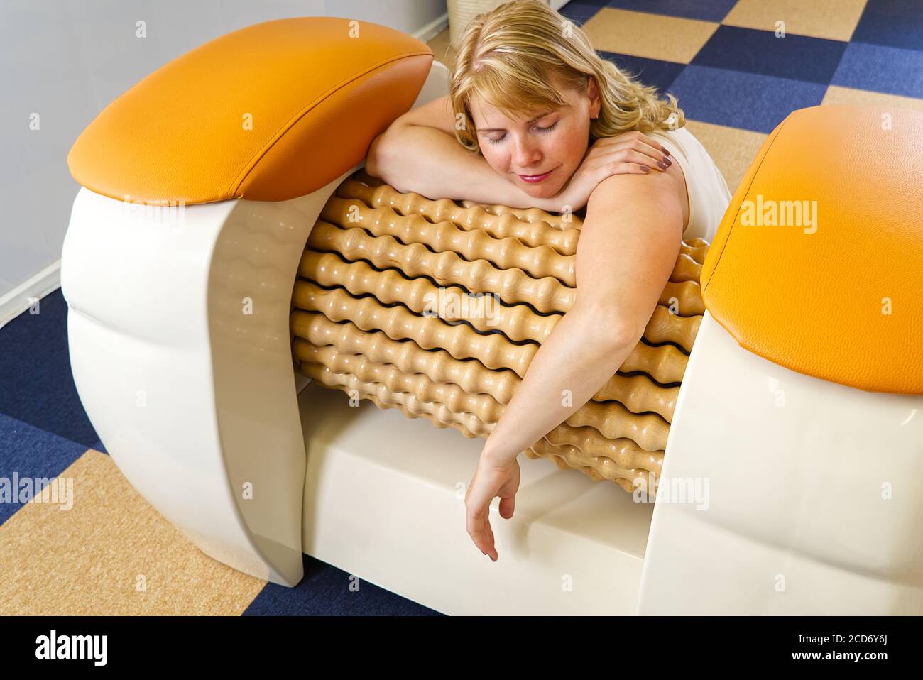 woman making massage for hand. Roll Massage machine is a way to shape ...