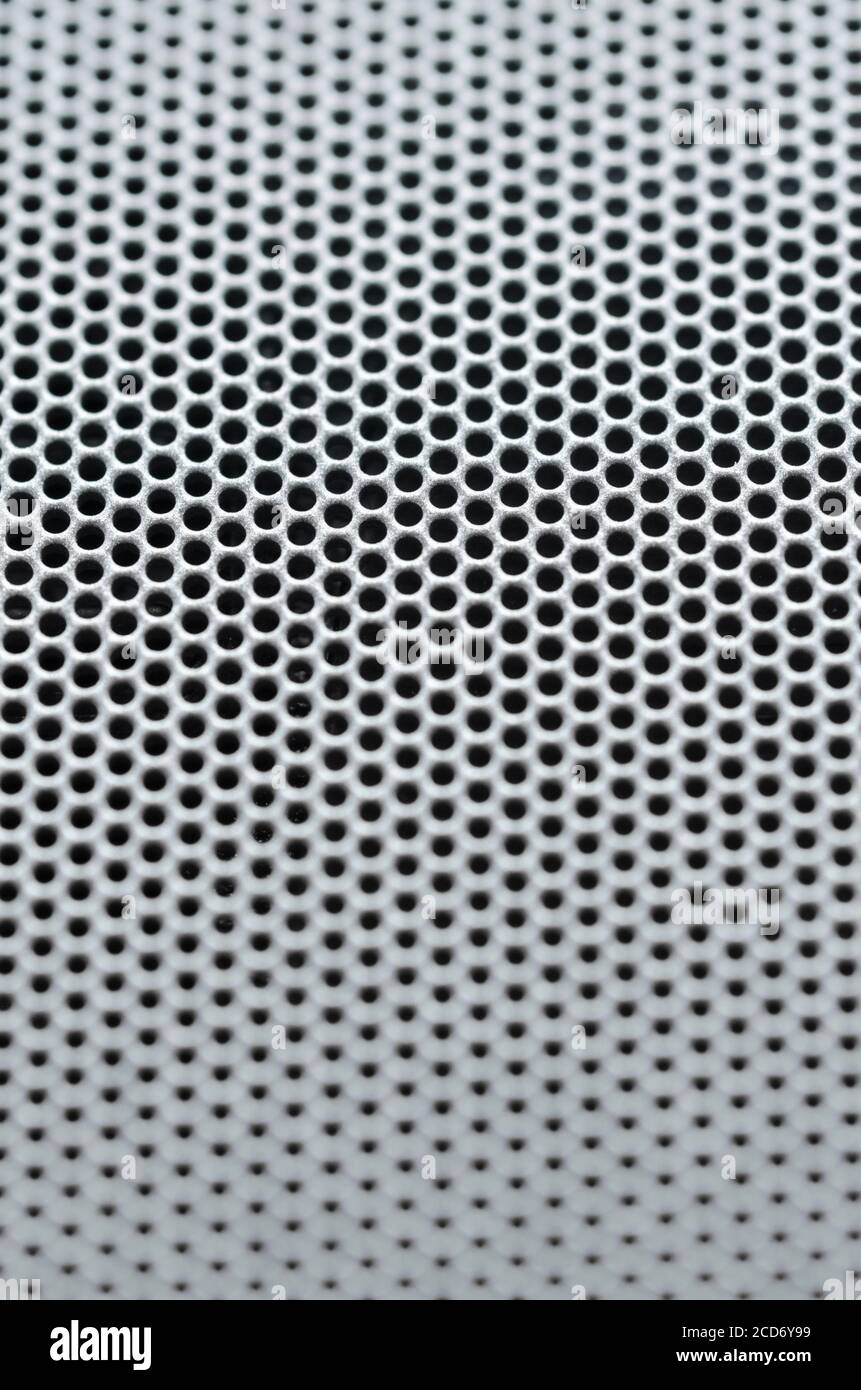 Extreme close-up with shallow depth of field of abstract metallic mesh ...