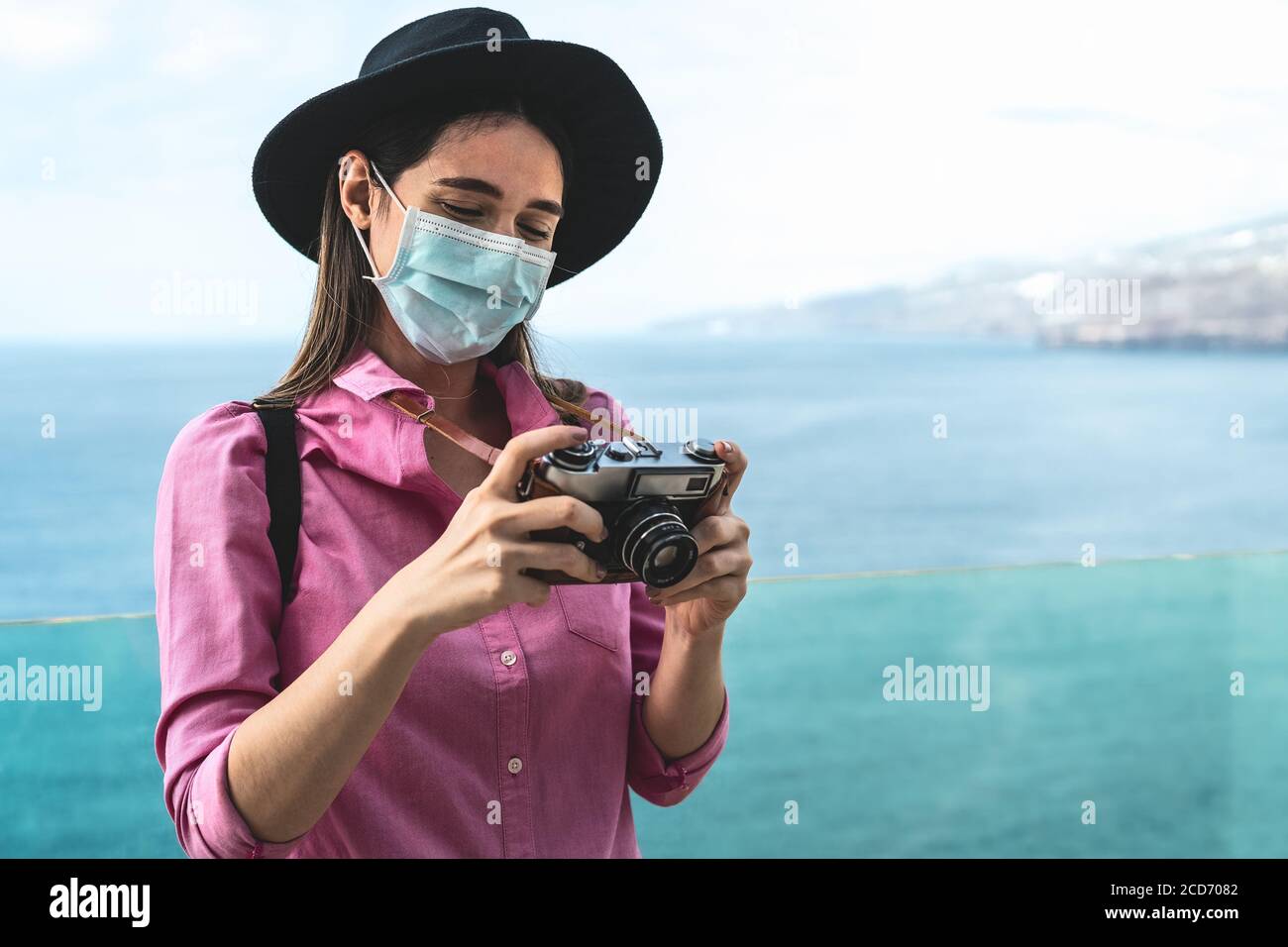 Young travel woman photographing with old vintage camera - Happy girl ...