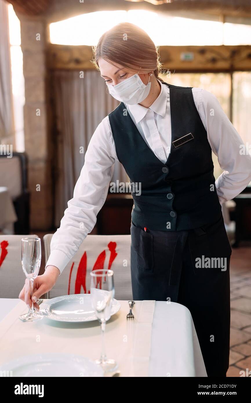 Table setting restaurant waiter mask hi-res stock photography and ...