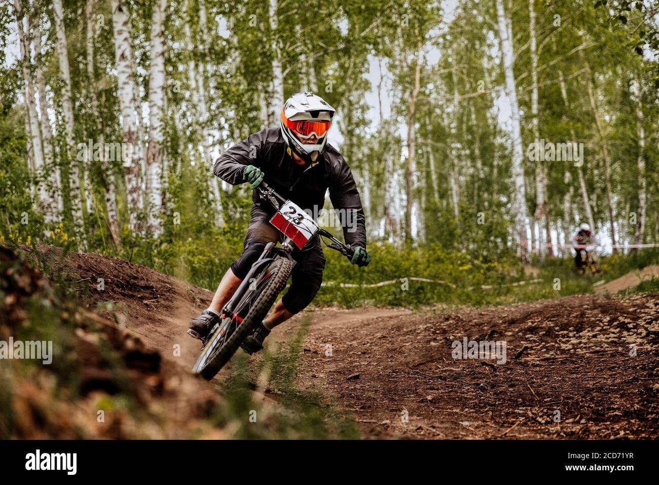 athlete freeride biker riding turn in downhill competition Stock Photo ...