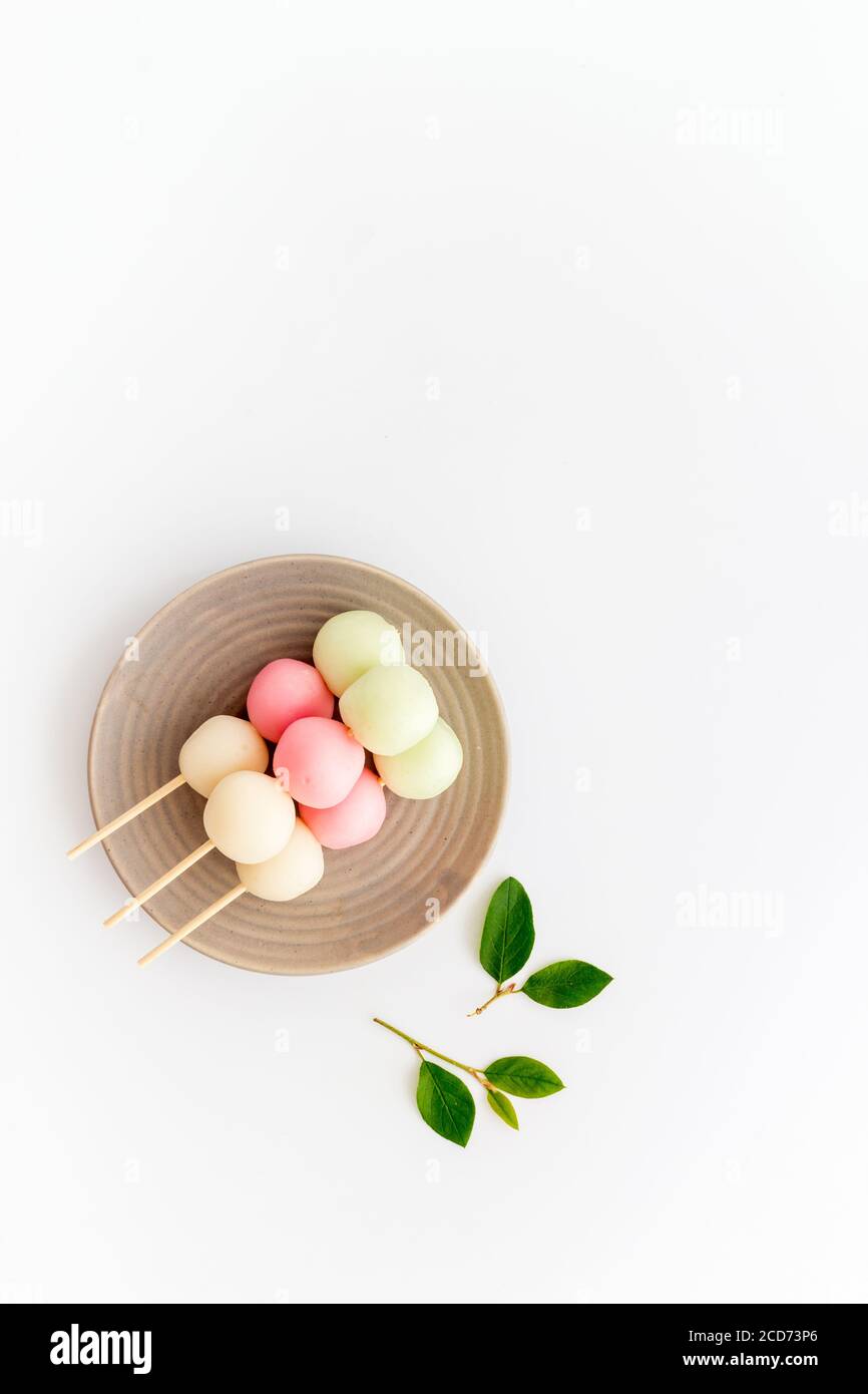 Japanese Dango dessert in pink, white and green colors, copy space ...