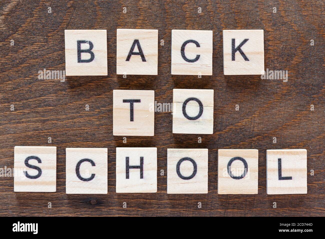 stop motion animation with lettering back to school with light wooden ...