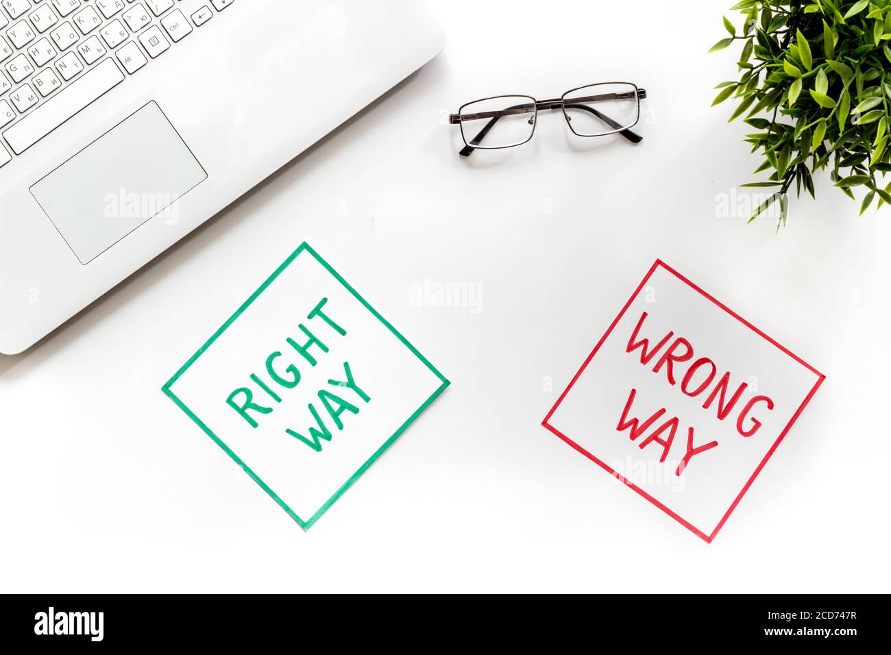 Problem solving. Right and wrong way icons on work desk from above ...