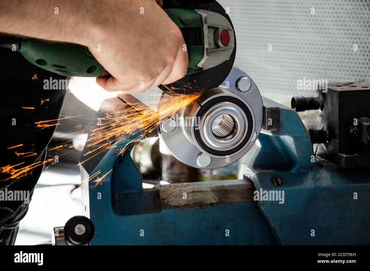 Cutting the hub with a circular electric saw on the vice Stock Photo ...
