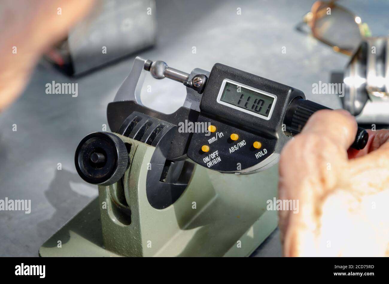 Device for measuring the thickness of a metal product Stock Photo - Alamy