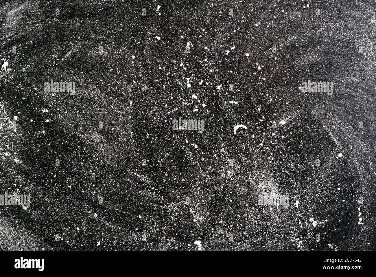 Flour on black background Stock Photo - Alamy