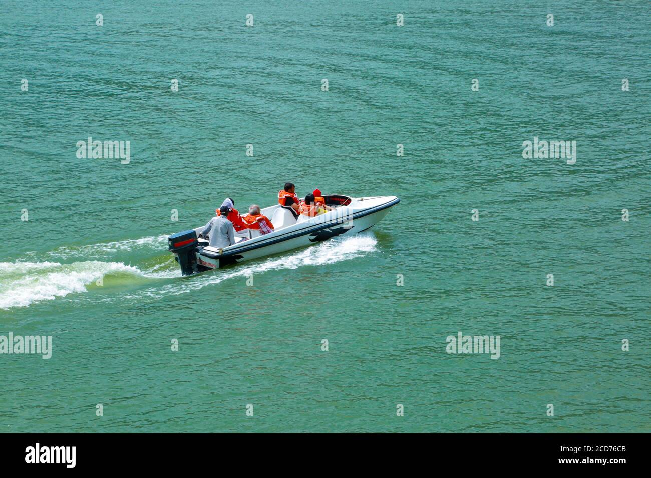 Happy family boating on the lake Stock Photo - Alamy